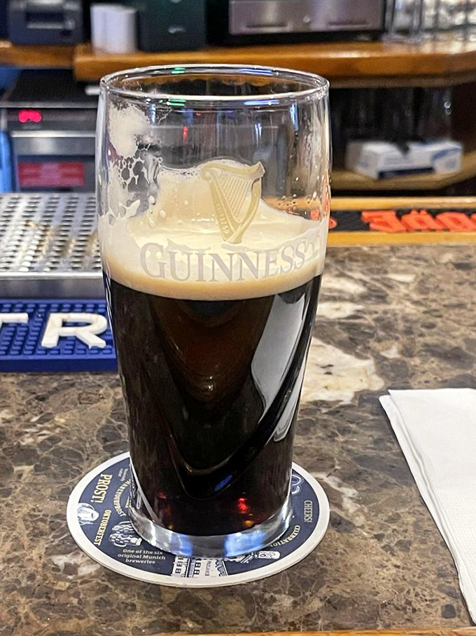 A properly poured Guinness is a work of art—dark as night with a creamy head that's worth the wait.