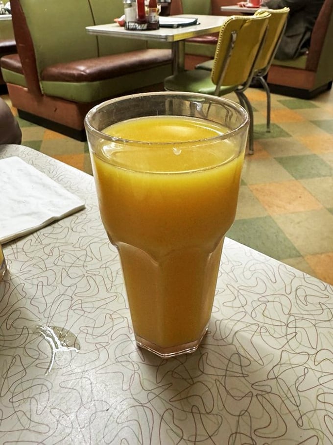 That's not just orange juice—it's liquid sunshine in a glass, ready to wash down whatever Southern comfort you've chosen from the menu.