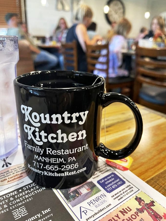 That black coffee mug—a portal to refills, conversation, and the simple pleasure of lingering over breakfast without anyone rushing you out.