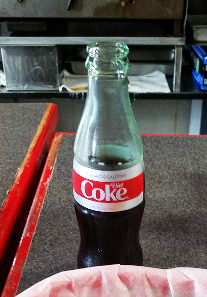 Nothing complements a hot dog quite like an ice-cold Coke in a glass bottle—some traditions don't need improving.