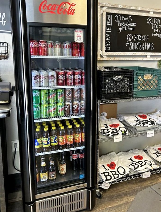 The beverage cooler and merchandise corner – because sometimes you need a cold drink and a t-shirt to commemorate your meat sweats.