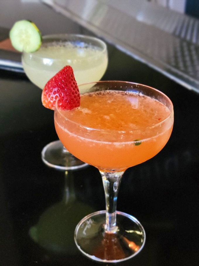 Cocktails that dress to impress—that strawberry number isn't just Instagram bait; it's a legitimate reason to skip dessert. Almost.