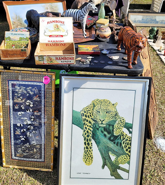 Art finds unexpected homes at the swap meet. That leopard print isn't just a painting—it's someone's future conversation piece waiting to claim prime wall real estate.