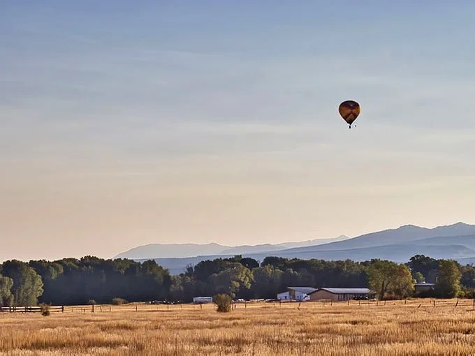 Hot air ballooning over Teton Valley – where social distancing was cool long before it was mandatory. Golden fields below, endless blue above, and silence that speaks volumes.