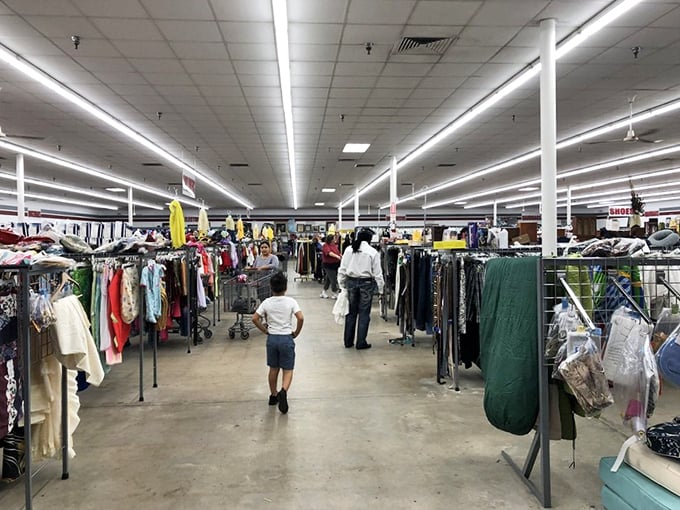 The main thoroughfare of possibility. Every aisle a different neighborhood in this secondhand metropolis where families hunt for bargains.