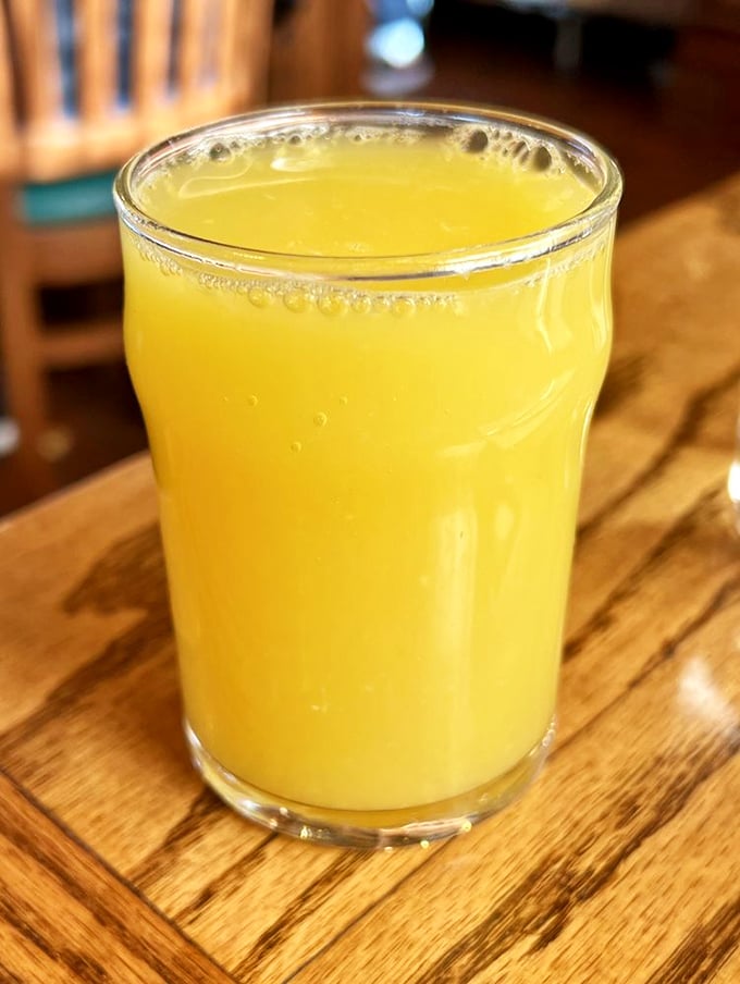 Fresh-squeezed orange juice that glows like liquid sunshine—the perfect sidekick to whatever pancake adventure you're about to embark upon.