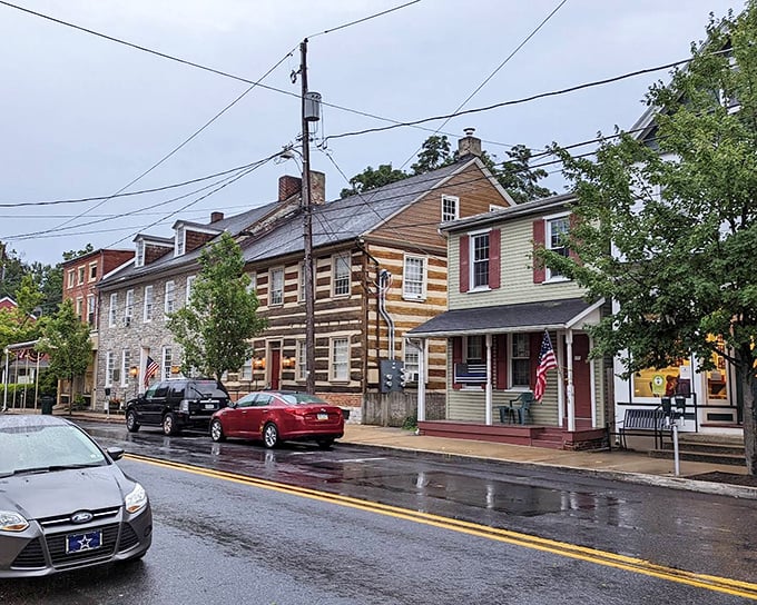 Rain-slicked streets reflect the colorful history of Lititz, where log cabins stand shoulder-to-shoulder with brick townhomes in a timeline of American architecture.