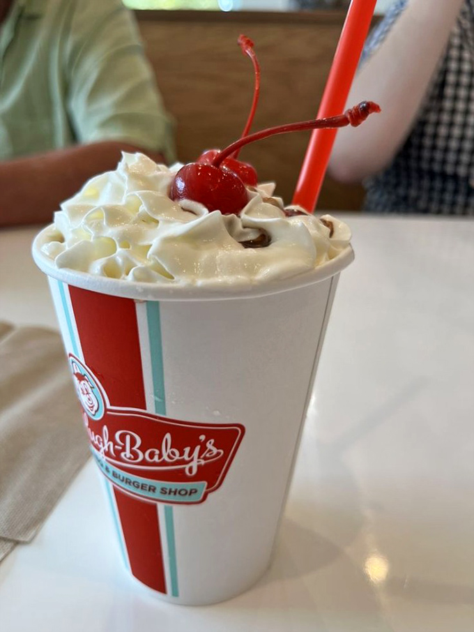 Not just a milkshake but a time machine—thick enough for a spoon, topped with whipped cream and that essential cherry on top.