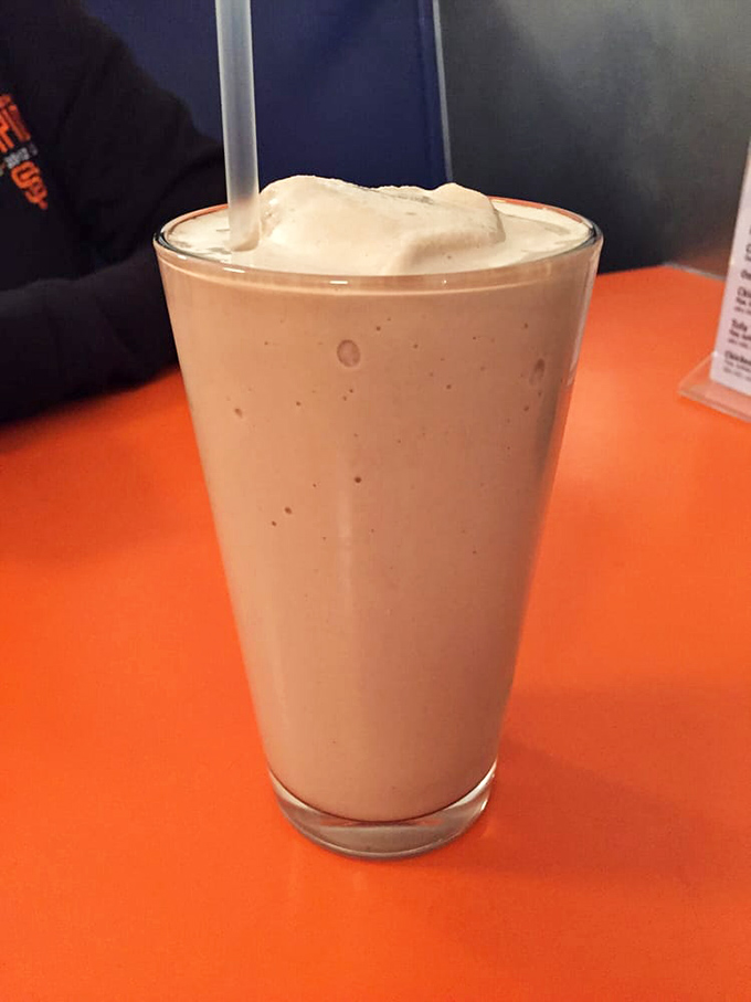 This isn't just a milkshake—it's a frothy commitment to happiness. Thick enough to require serious straw strength but worth every bit of effort.