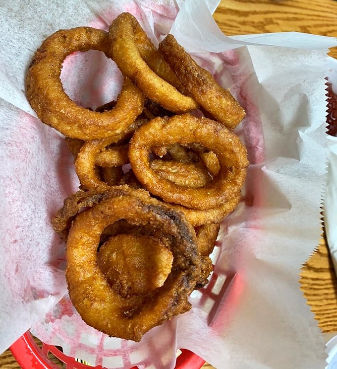 Golden onion rings with the perfect crunch-to-tenderness ratio. These aren't just sides—they're supporting actors worthy of their own spotlight.