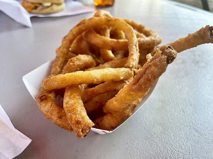 Golden halos of happiness. These onion rings achieve the perfect crunch-to-tenderness ratio that makes you wonder why you'd ever order anything else.