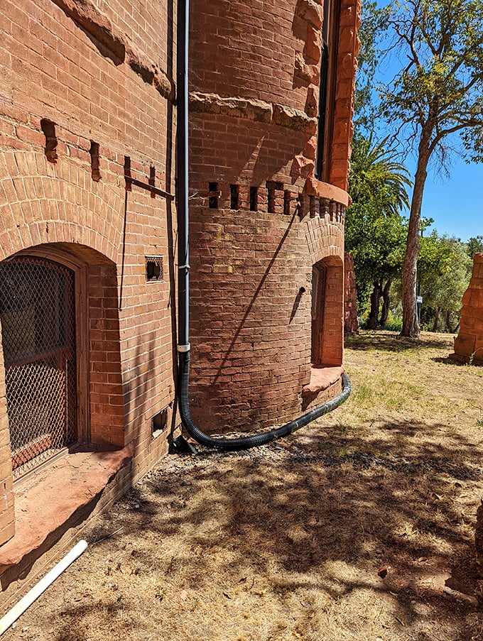 The castle's cylindrical turret and arched doorway could be straight from a medieval European fortress, yet here it stands in rural California, defying both time and geography.