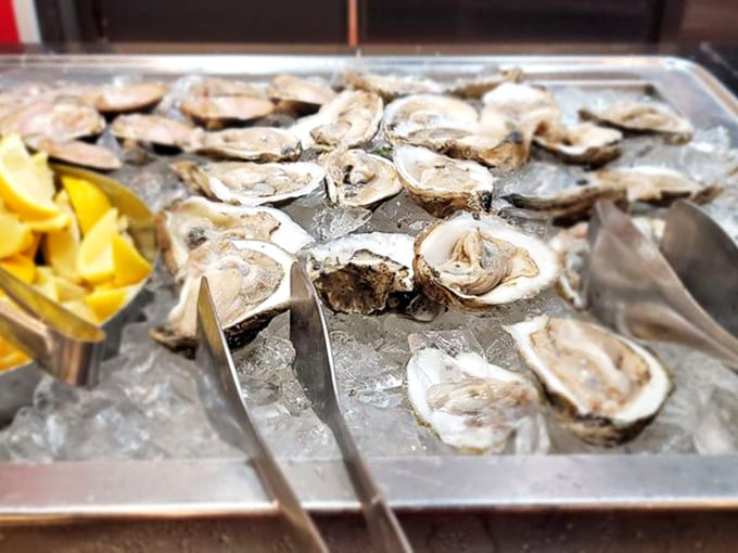 These oysters on ice are nature's perfect appetizer—briny treasures waiting to be adorned with just a squeeze of that lemon nearby.