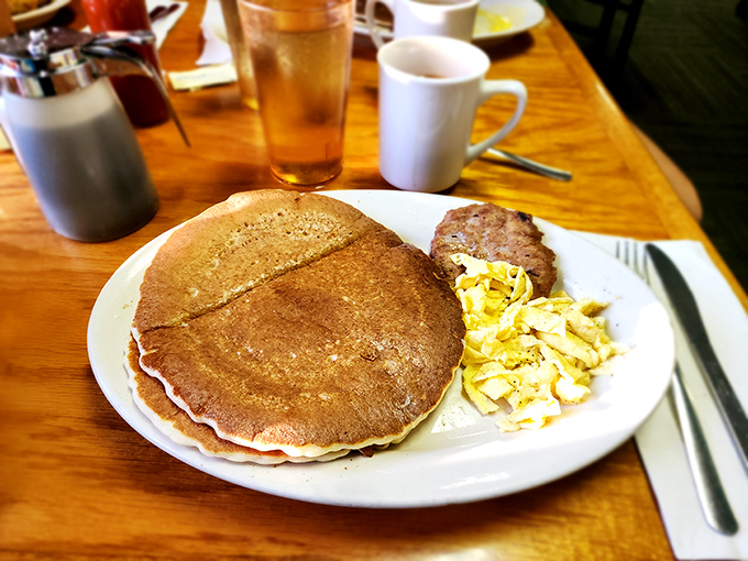 That's not a pancake – it's a golden-brown frisbee of joy that makes you question why you ever settled for silver-dollar sized versions.