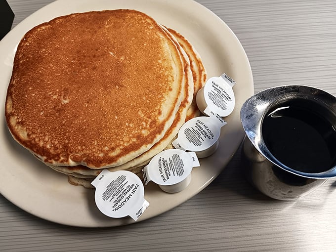 Pancakes so perfectly golden they deserve their own Instagram account. Four creamers standing by, ready for their supporting role in your coffee.