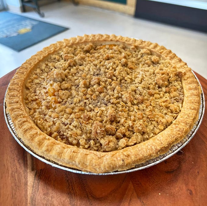 This crumb-topped masterpiece isn't just a pie – it's an architectural achievement with a PhD in comfort food. The golden crust deserves its own Nobel Prize.