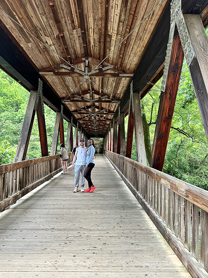 This covered bridge doesn't just connect two shores – it connects generations. Like a wooden time machine with excellent Instagram potential.