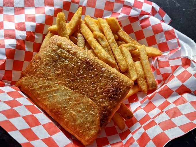 The pizza puff—Chicago's answer to the empanada—golden-fried and ready to challenge your notion of what belongs with fried chicken.