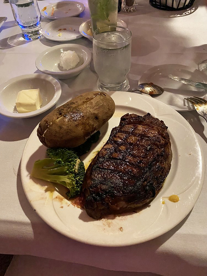 A perfectly seared ribeye with all the classic accompaniments – proof that some traditions deserve preservation in our rapidly changing culinary landscape.