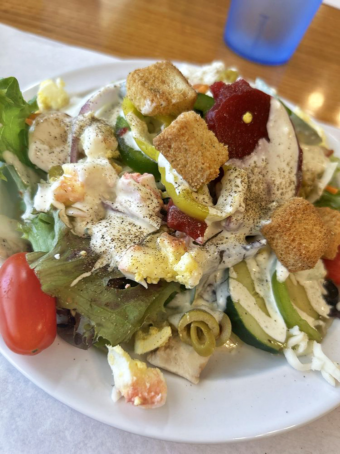 A salad that doesn't apologize for being exactly what it is – fresh, colorful, and loaded with enough toppings to make vegetables an actual celebration.