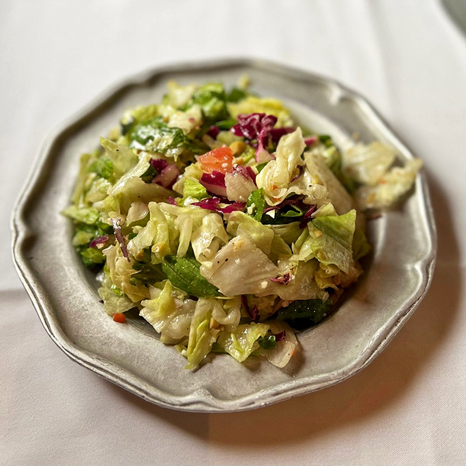Not just any salad—a crisp, colorful rebellion against boring greens that proves vegetables can hang with the steakhouse big boys.