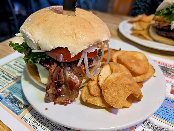 A burger that requires both hands and a strategy. Juicy meat, fresh toppings, and those homemade potato chips – lunch doesn't get better than this.