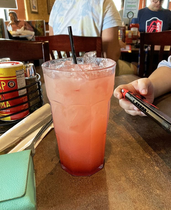 This isn't just strawberry lemonade—it's summer in a glass, the kind that makes you want to sit longer and order "just one more."