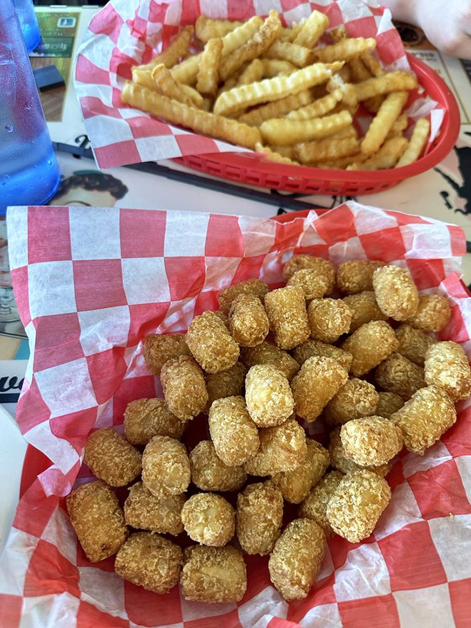 Golden tater tots and crinkle fries—the dynamic duo of side dishes that have been making vegetables jealous since the 1950s.