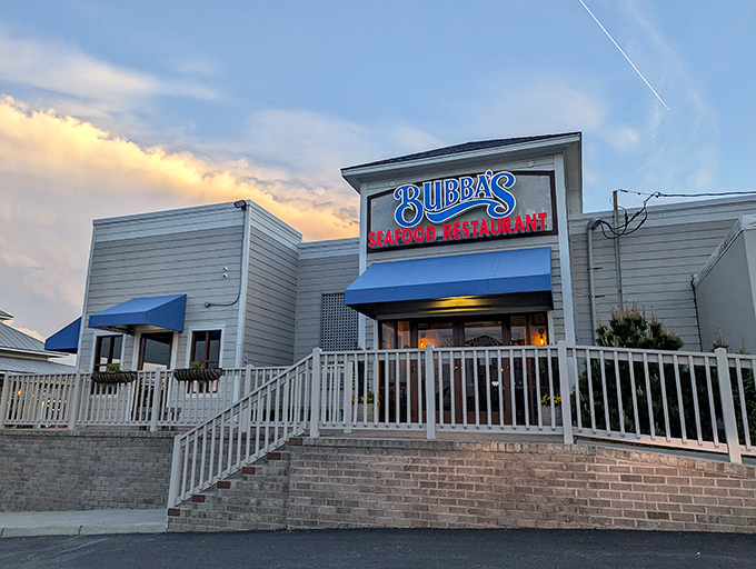 Bubba's glowing sign against the twilight sky is like a lighthouse guiding hungry sailors to crab cake heaven.