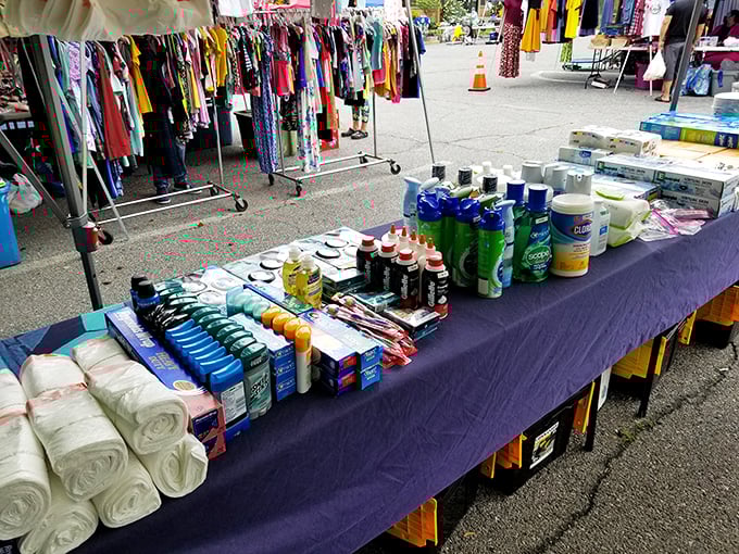 Fresh towels and household essentials spread like a suburban convenience store meets neighborhood yard sale.