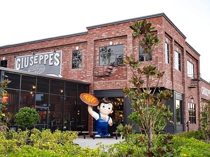 That giant pizza-holding statue outside Giuseppe's isn't just cute – it's a beacon of Steel City pizza excellence in Port Orange.