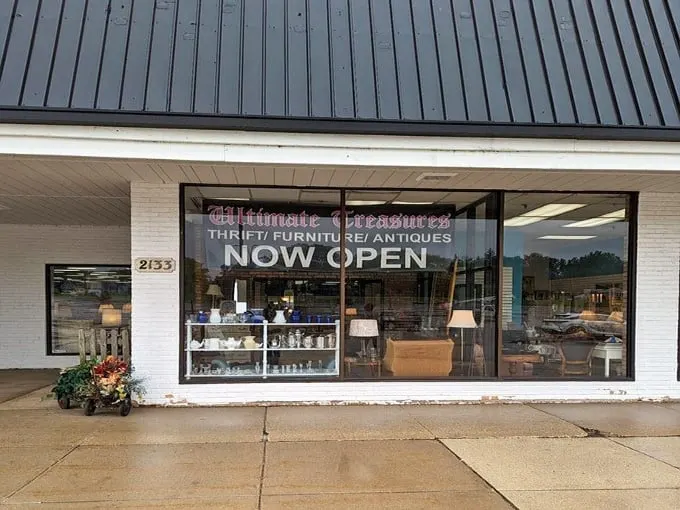 Ultimate Treasures' storefront showcases furniture finds through spotless windows - just a taste of what awaits inside.