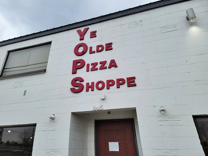 Those bold red letters on white might as well say "Time Machine" – Ye Olde Pizza Shoppe is deliciously stuck in the past.