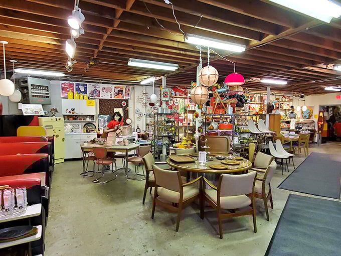 Vintage furniture arranged like a 1960s living room catalog – Flower Child knows how to set a retro scene.