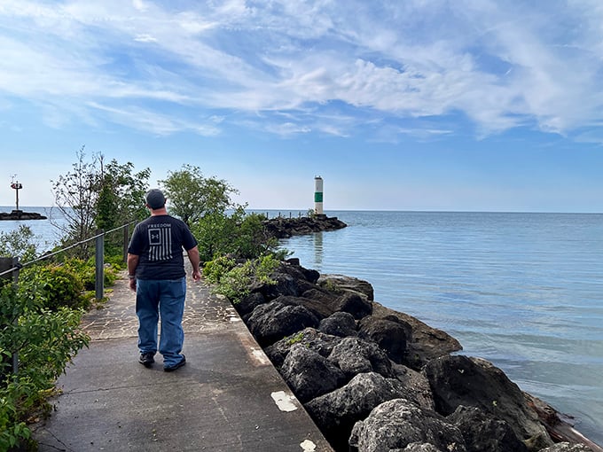 Geneva State Park: "Lighthouse in the distance. Some walks aren't about the steps—they're about the horizon that keeps pulling you forward."