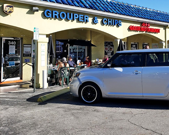 That blue awning marks the spot where grouper dreams come true, one perfect sandwich at a time.