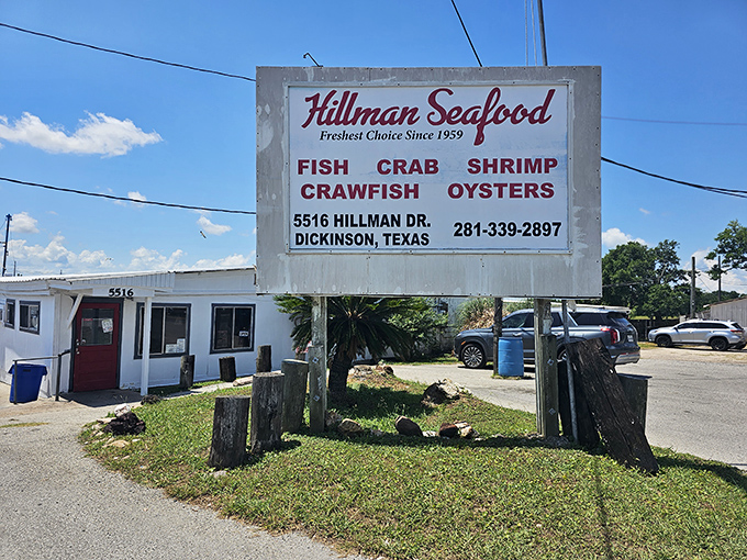 Simple white building, extraordinary seafood inside. Hillman's hand-painted sign promises Gulf treasures that have kept locals coming back for generations.