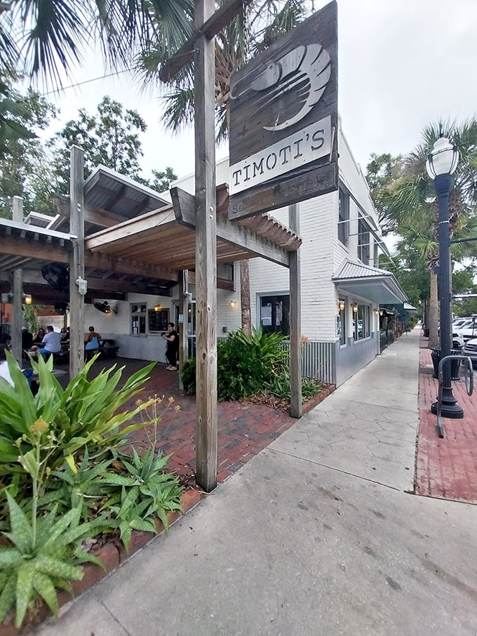 This isn't just a restaurant—it's a slice of old Florida. Timoti's wooden shrimp sign promises sweet local catches inside.