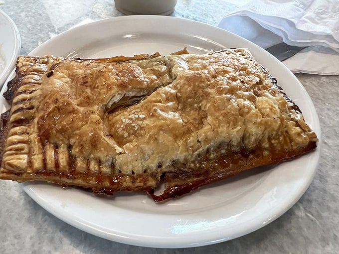 This isn't just apple pie—it's what apple pie dreams of becoming when it grows up. Flaky, golden, and unapologetically buttery.
