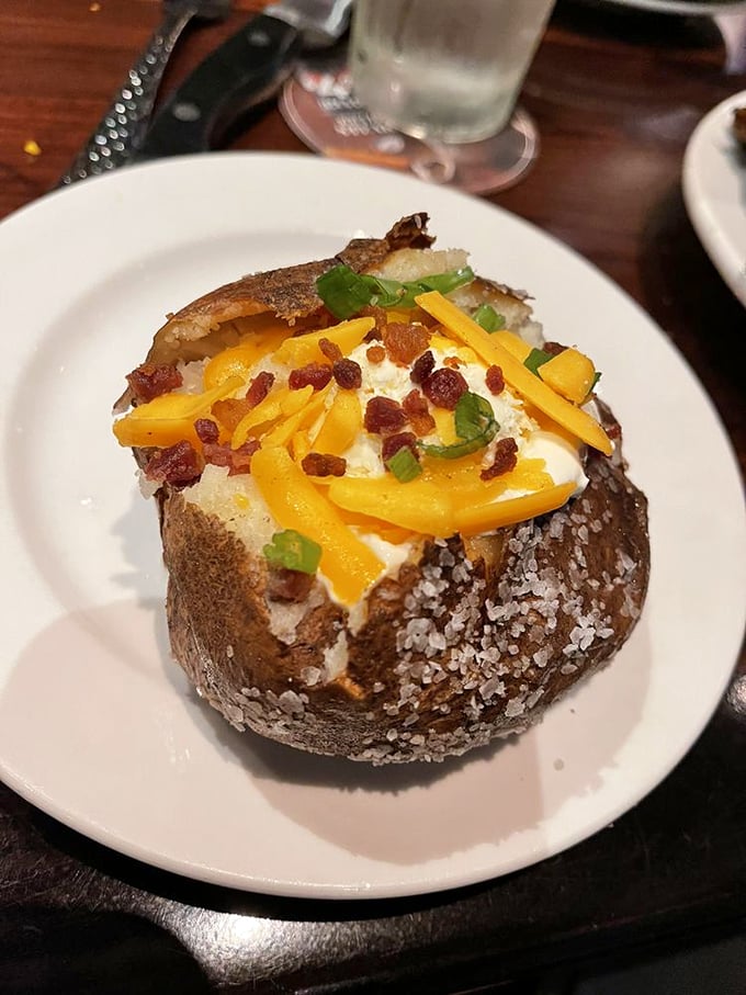 Not just any potato—this loaded spud is a canvas of excess, topped with cheese, bacon, and green onions. Carb-counting is tomorrow's problem.