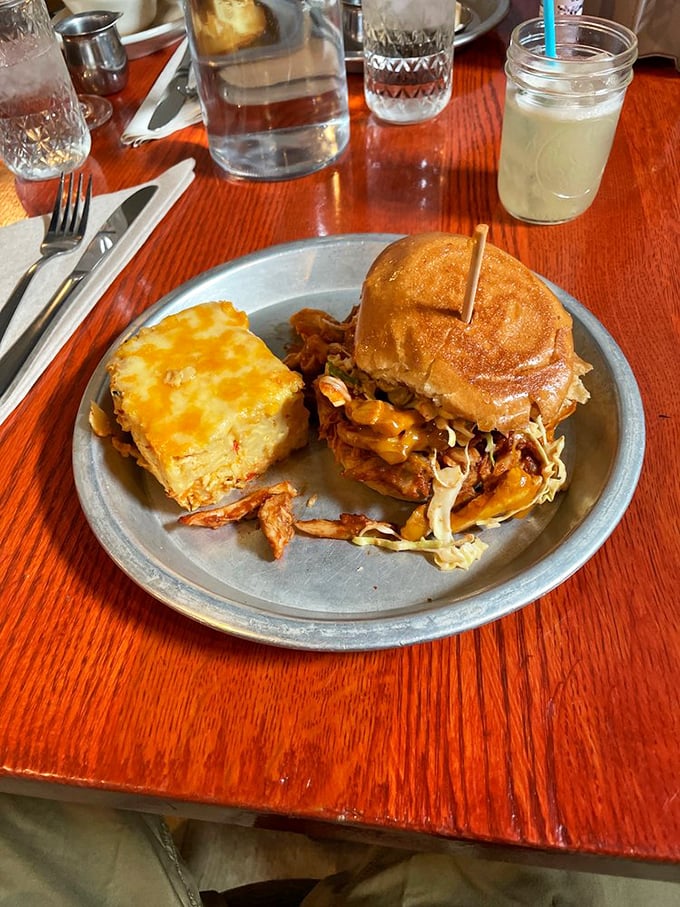 The unholy alliance of BBQ chicken, melty cheese, and that square of pimento mac could make a cardiologist nervous – but oh, what a way to go.
