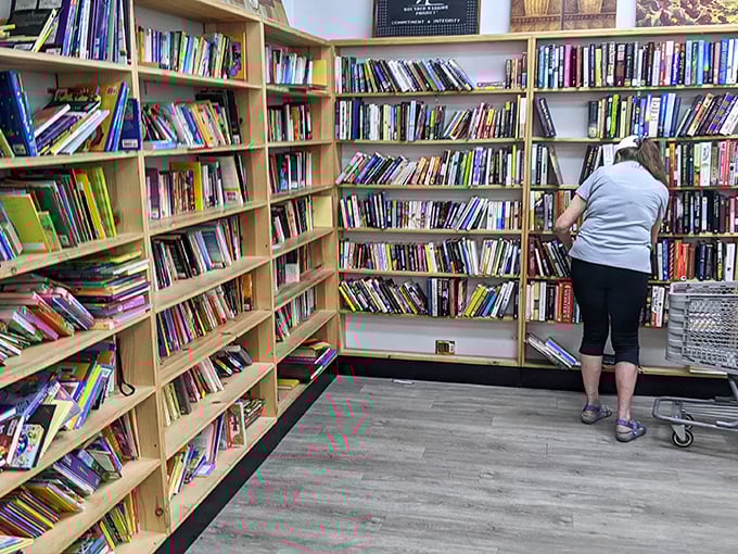 The book corner—where literary dreams cost less than a coffee. Browsers stand transfixed, hunting for that perfect beach read or forgotten classic.