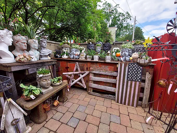 The outdoor garden area proves even bookstores need a breath of fresh air—and apparently, a collection of classical busts.