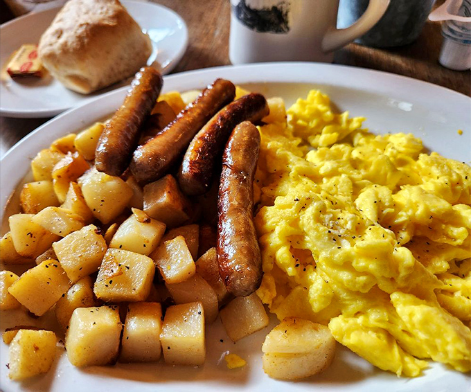 Breakfast that doesn't just break your fast – it demolishes it with military precision. Those sausages stand at attention like delicious sentinels.
