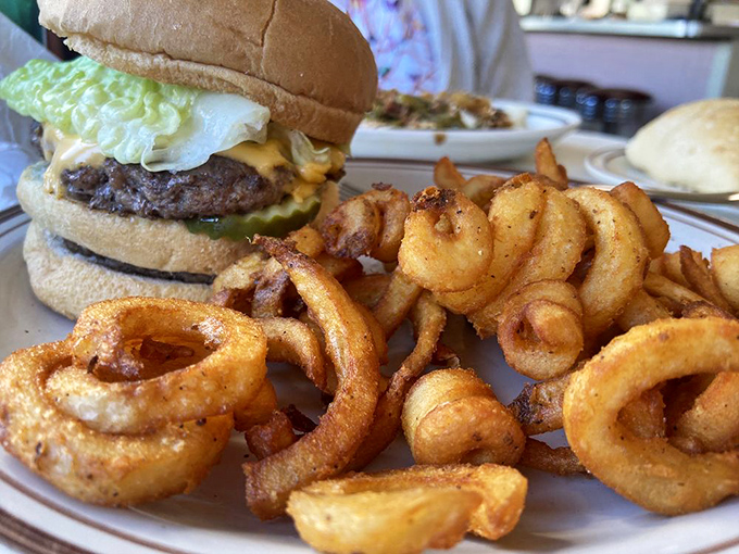 The burger and curly fries combo – America's most reliable mood enhancer since the invention of the lunch break.