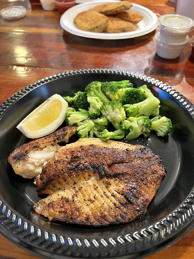This blackened tilapia with vibrant broccoli proves that not everything delicious at a seafood joint needs a bath in the fryer.