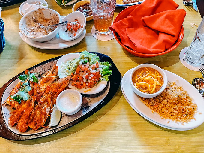 The Camarones Diablo arrive looking like the seafood equivalent of a sports car—sleek, spicy, and guaranteed to make your heart race.