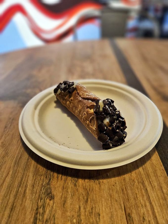 Not all heroes wear capes—some wear crispy pastry shells filled with sweet ricotta and dipped in chocolate. This cannoli deserves its own theme music.