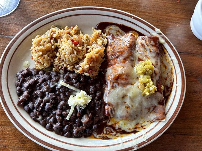 Cheese enchiladas that would make a dairy farmer proud. That rice has clearly been taking flavor lessons from someone's abuela.
