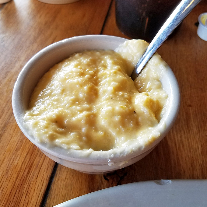Cheese grits so creamy and comforting they could end family feuds—Southern comfort in its most perfect form.